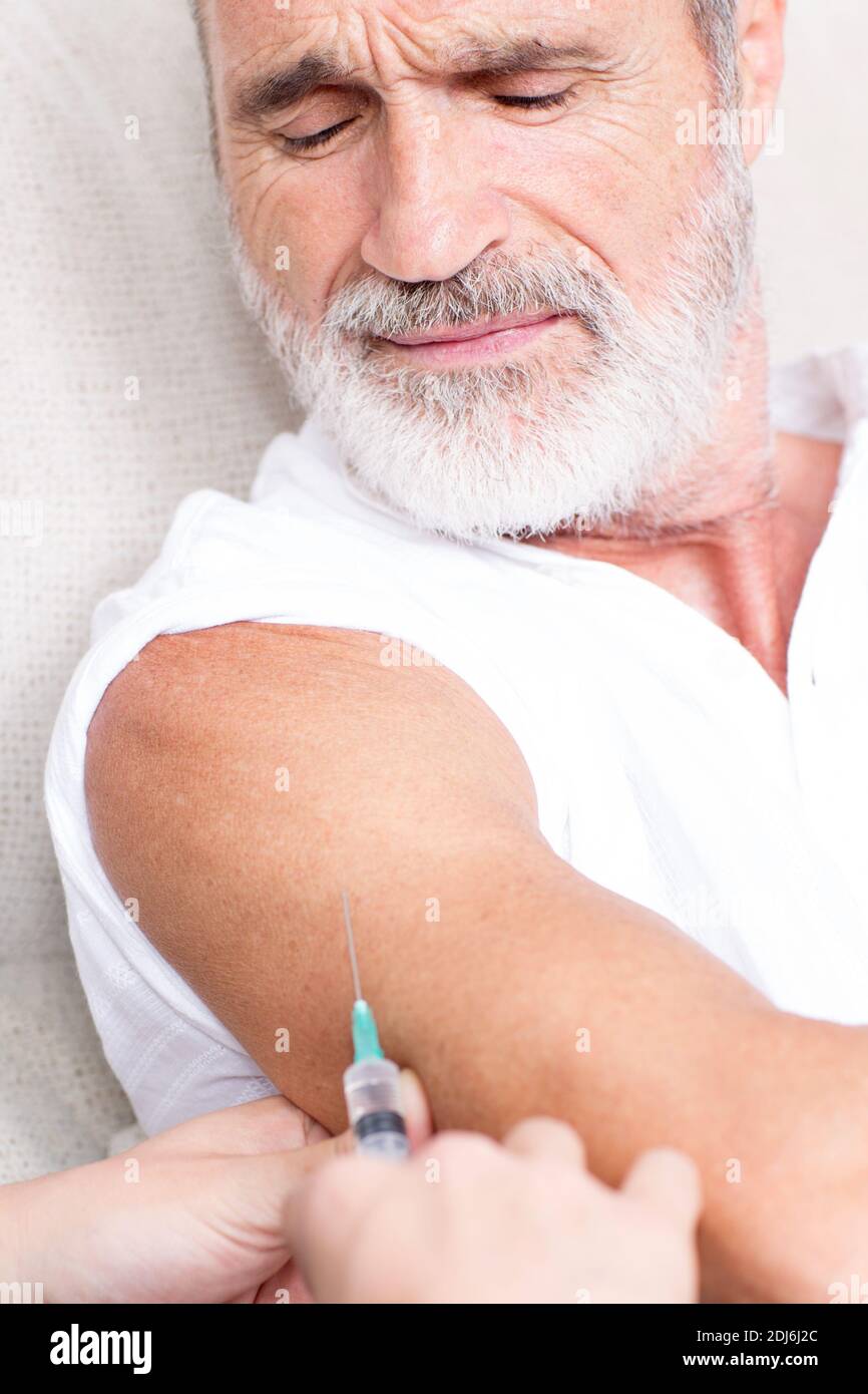Receiving vaccine shot senior hi-res stock photography and images - Alamy