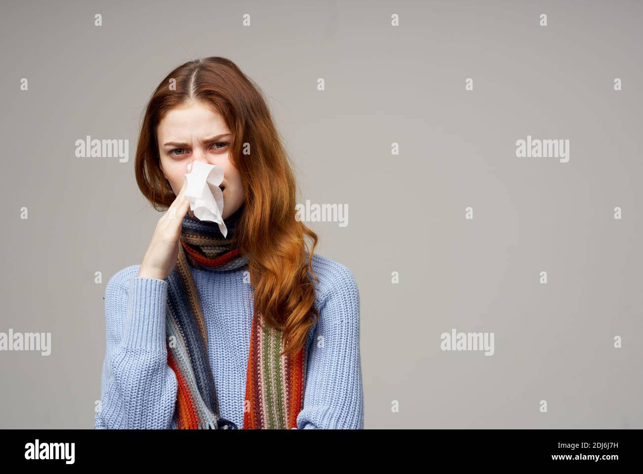 pretty woman wearing scarf model gray background red hair cropped view ...