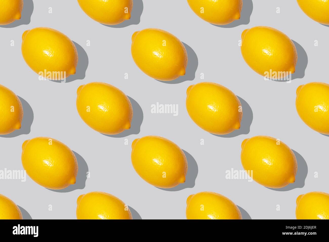 Seamless pattern of yellow lemons in the color of the year 2021 from ...