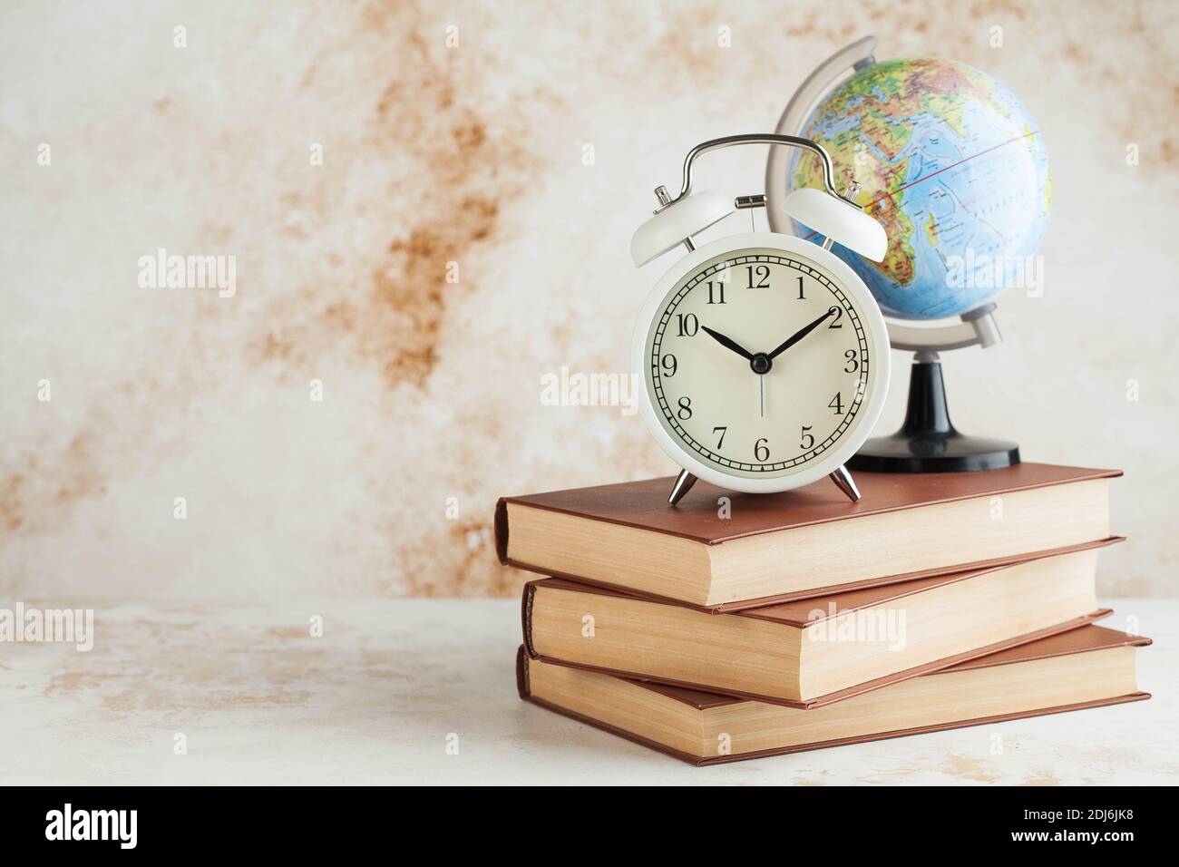 Globe Clock On Books High Resolution Stock Photography and Images - Alamy