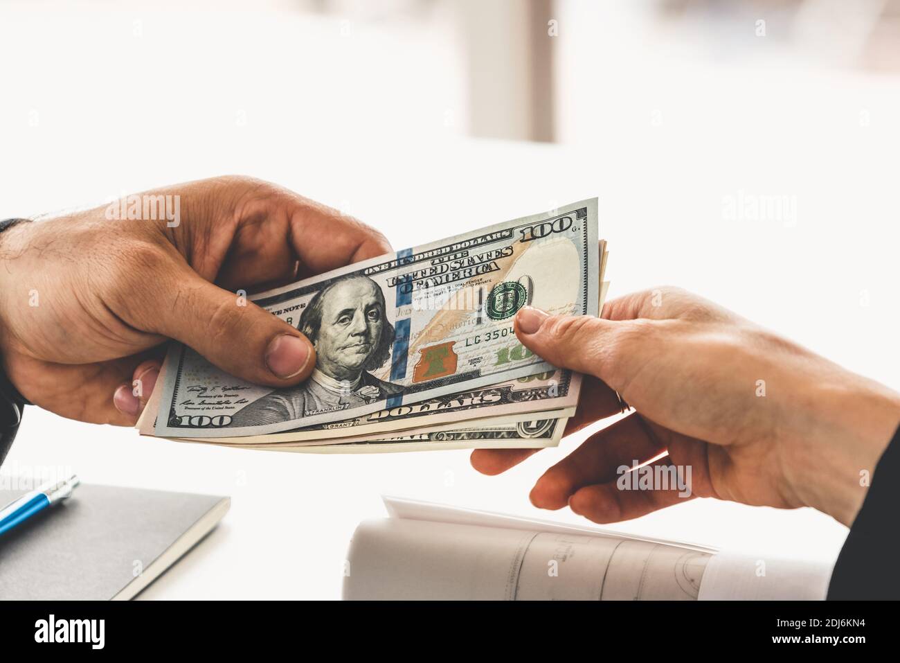 Hand giving paper another hand hi-res stock photography and images - Alamy
