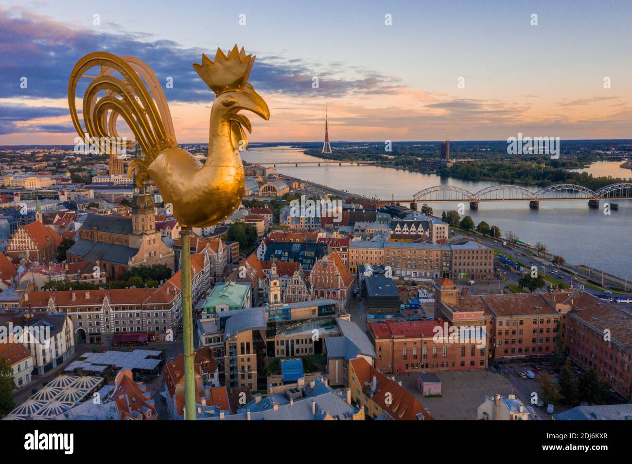 A closeup of a golden rooster on a tower in Riga surrounded by ...