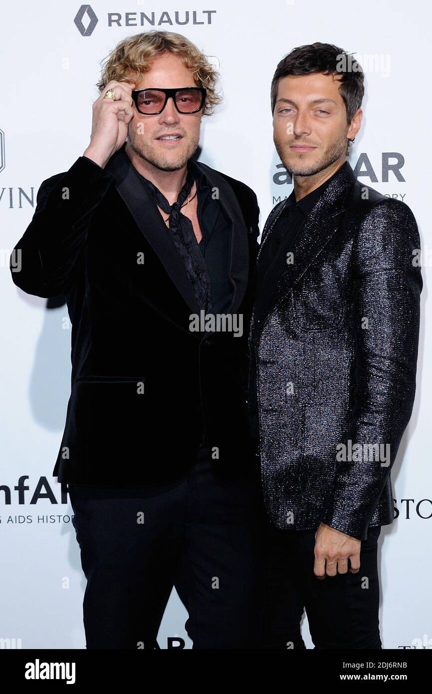 Peter Dundas and boyfriend attending the Amfar dinner as part of Paris ...
