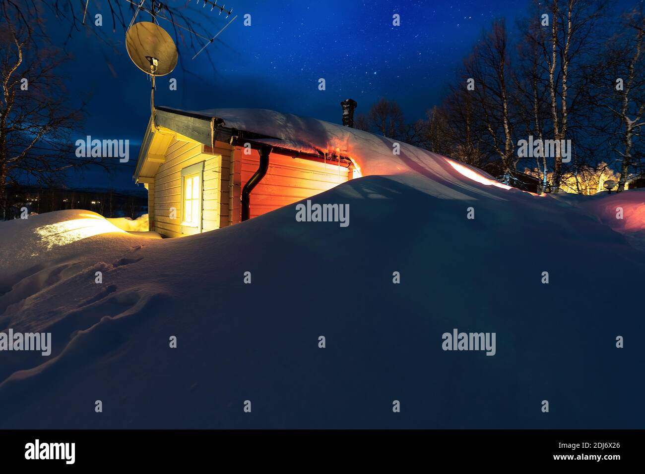 Scenic night photo of typical Swedish wooden mountain cabin with stars ...