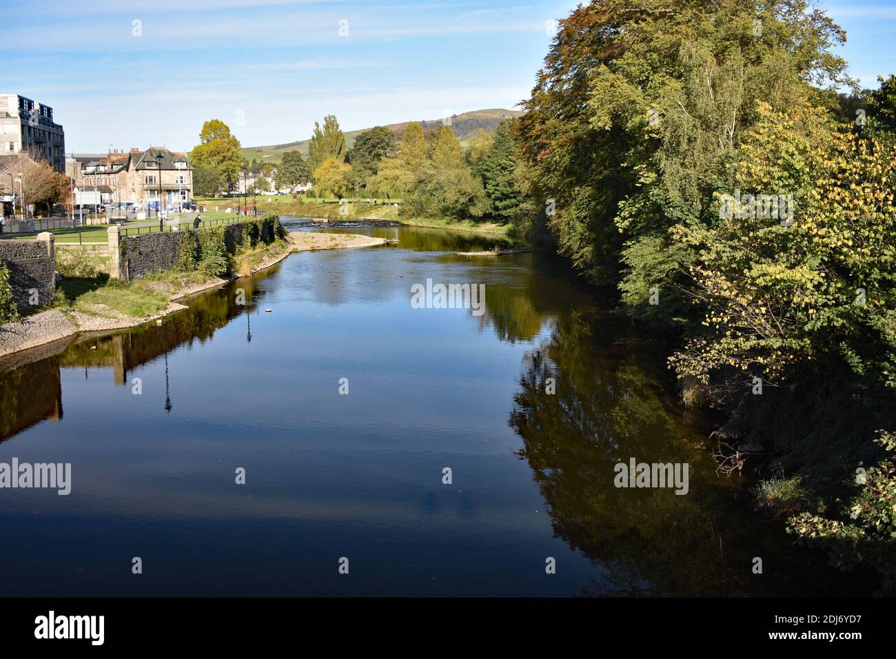 The tree lined River Kent as it flows through the town centre of Kendal ...