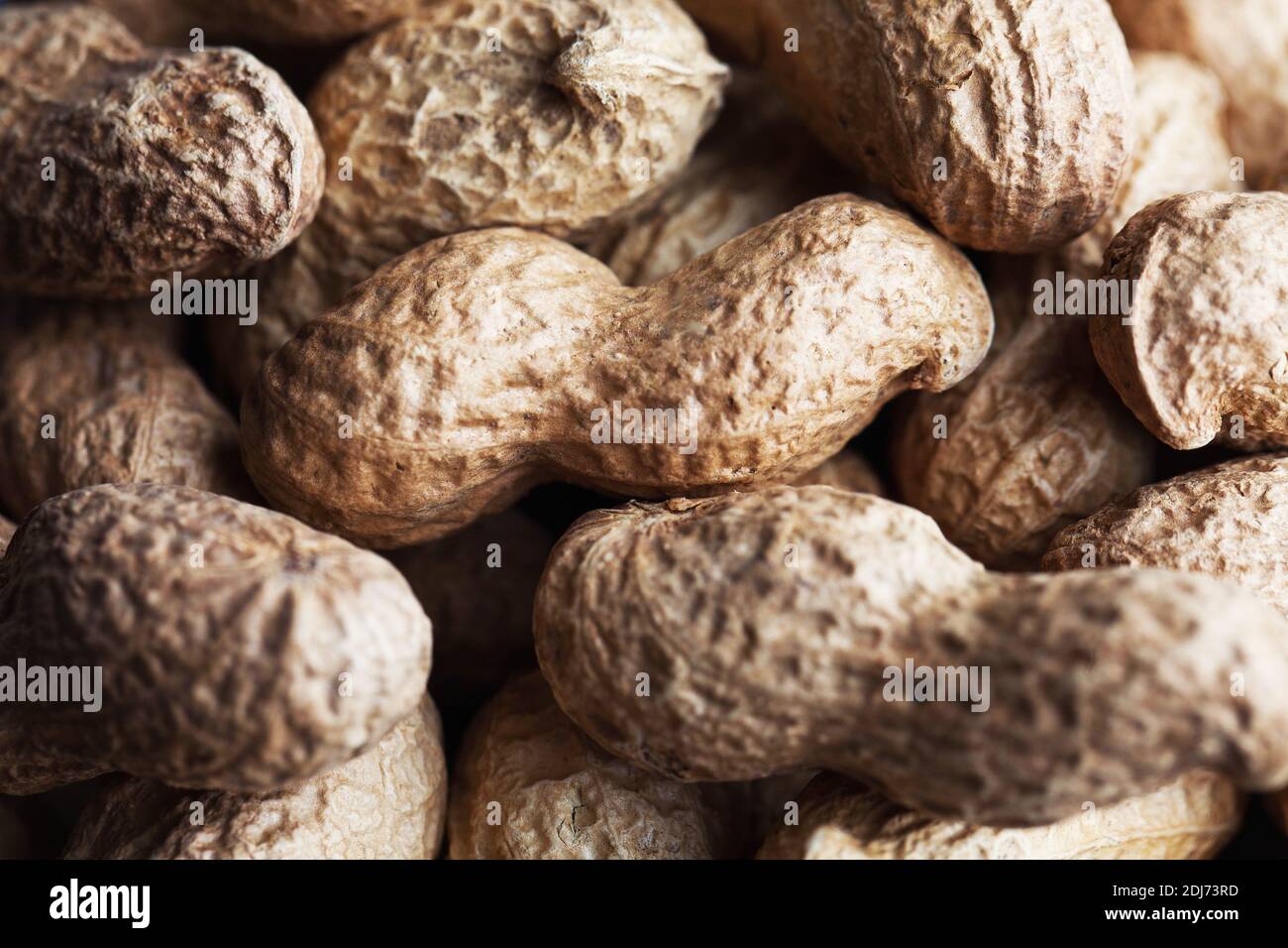 Healthy eating concept. Inshell peanuts closeup Stock Photo - Alamy