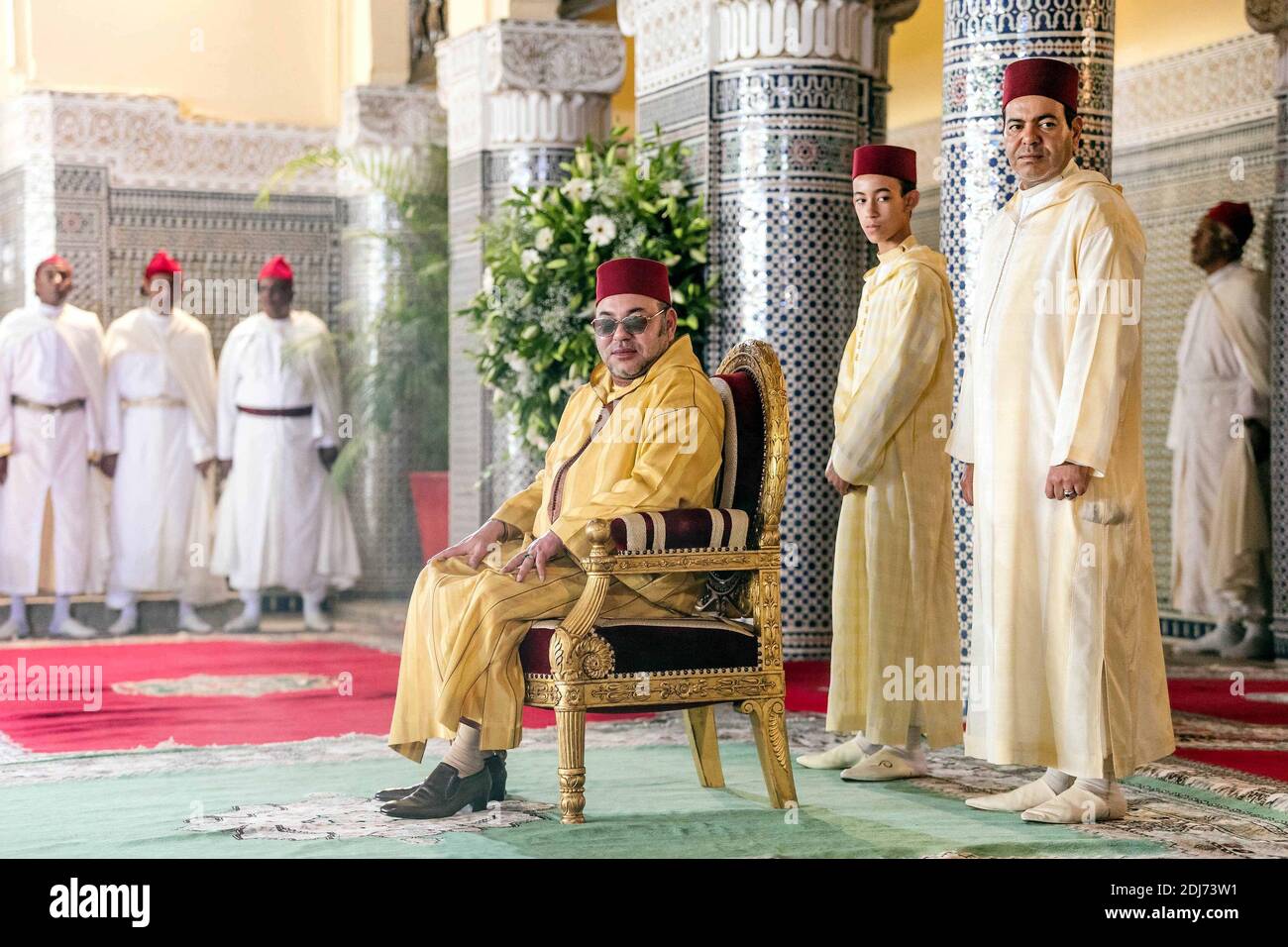 King Mohammed VI of Morocco (center), accompanied by his son, Prince ...