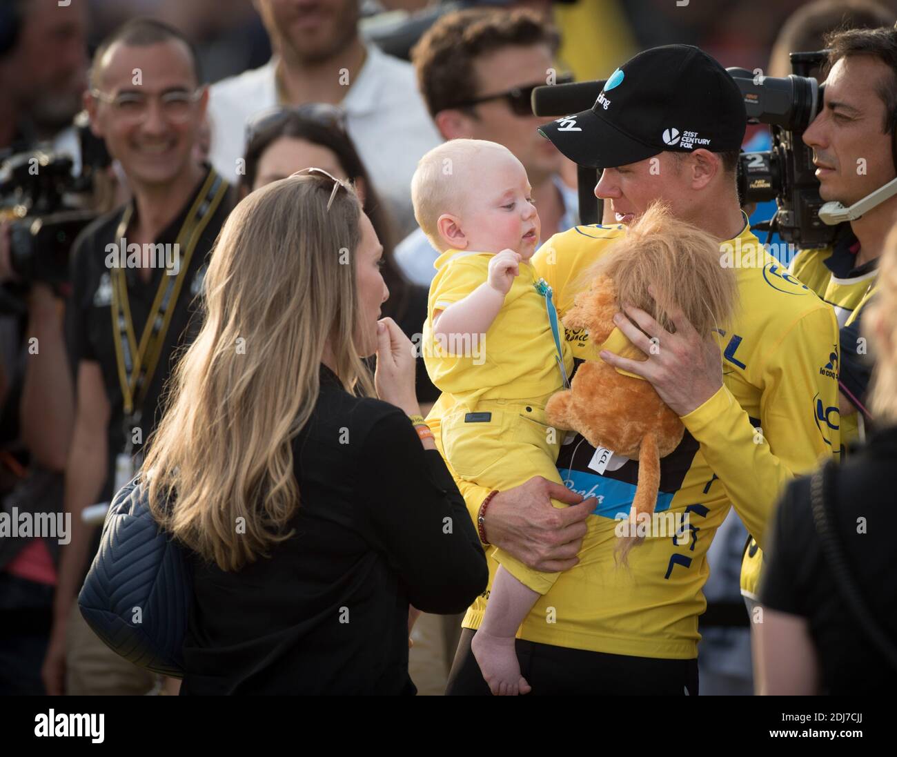 Chris Froome of Great Britain and Team Sky celebrates with his baby and ...
