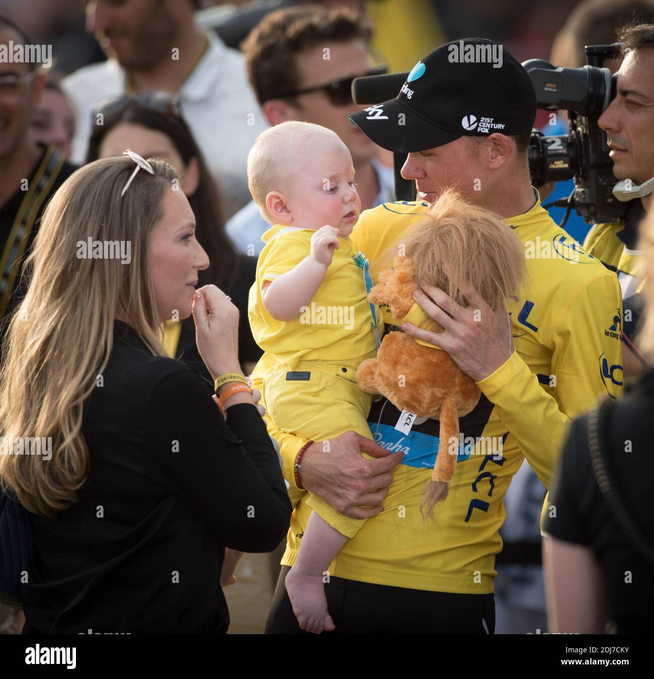 Chris Froome of Great Britain and Team Sky celebrates with his baby and ...