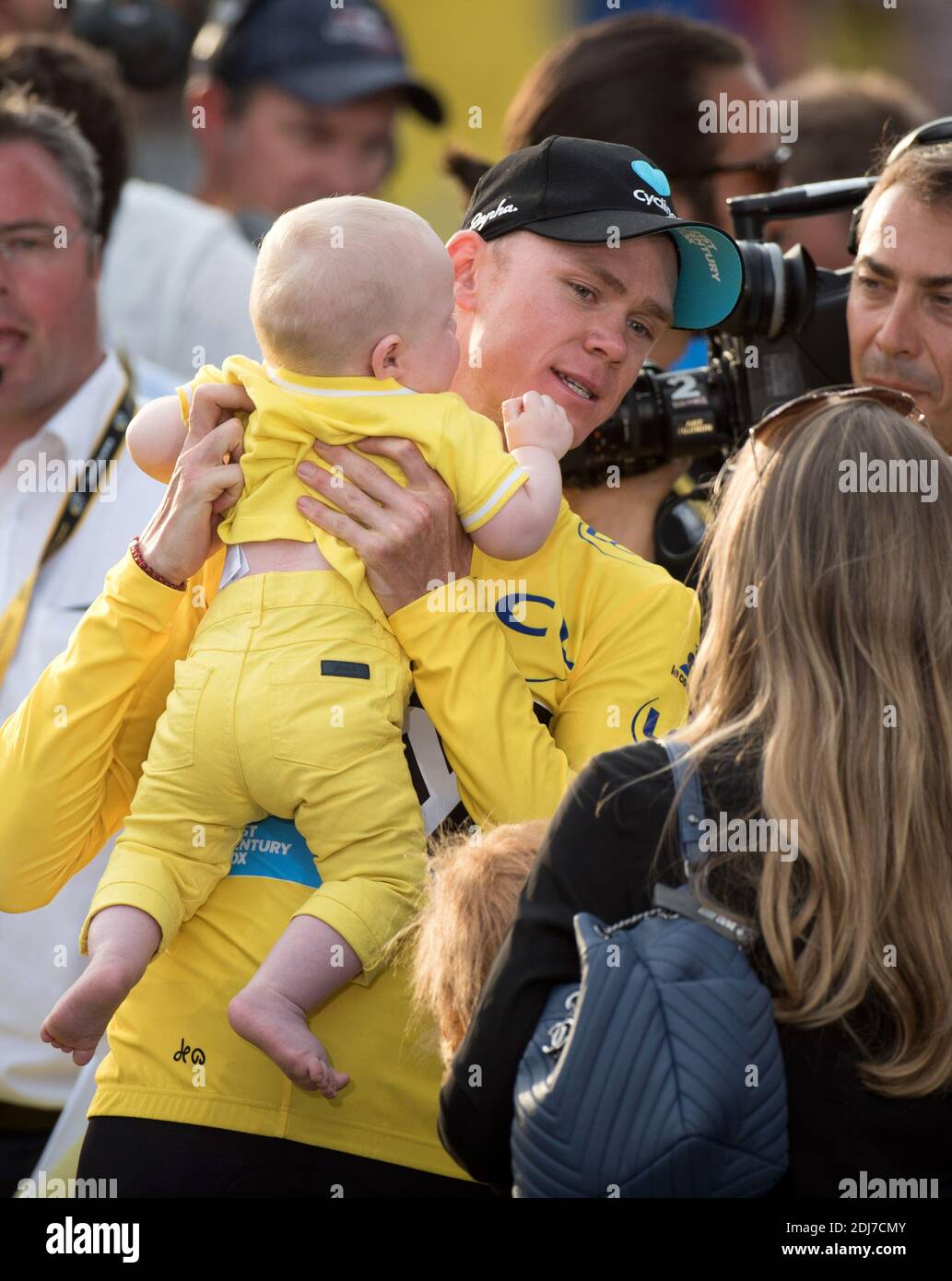 Chris Froome of Great Britain and Team Sky celebrates with his baby and ...