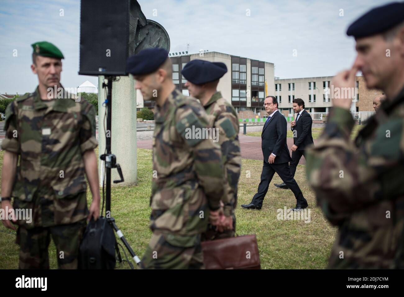 French President Francois Hollande, followed by GSPR security guard ...