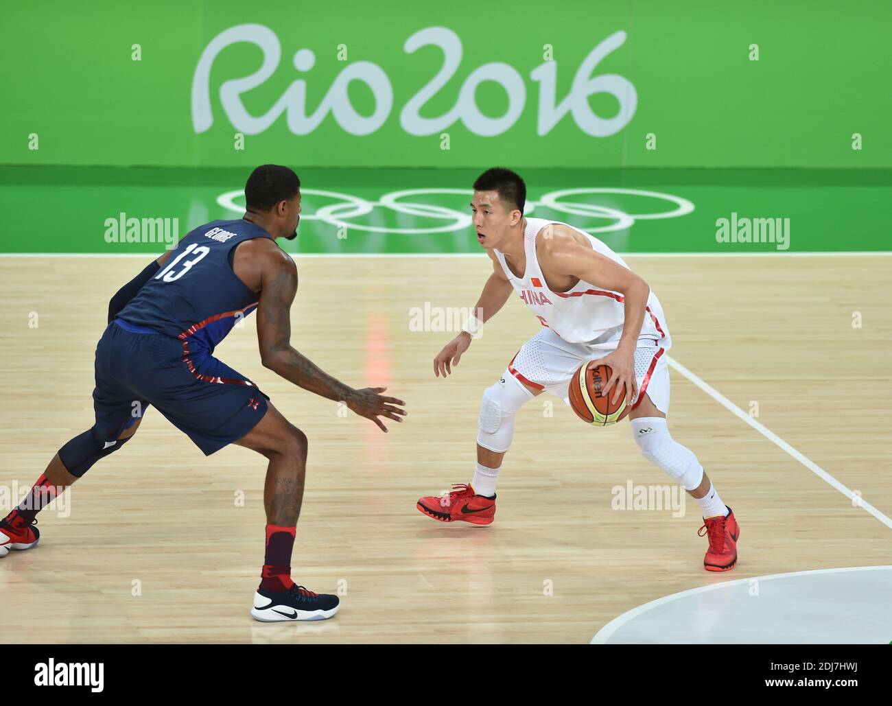Paul George and Ailun Guo in action during the China vs USA basketball ...