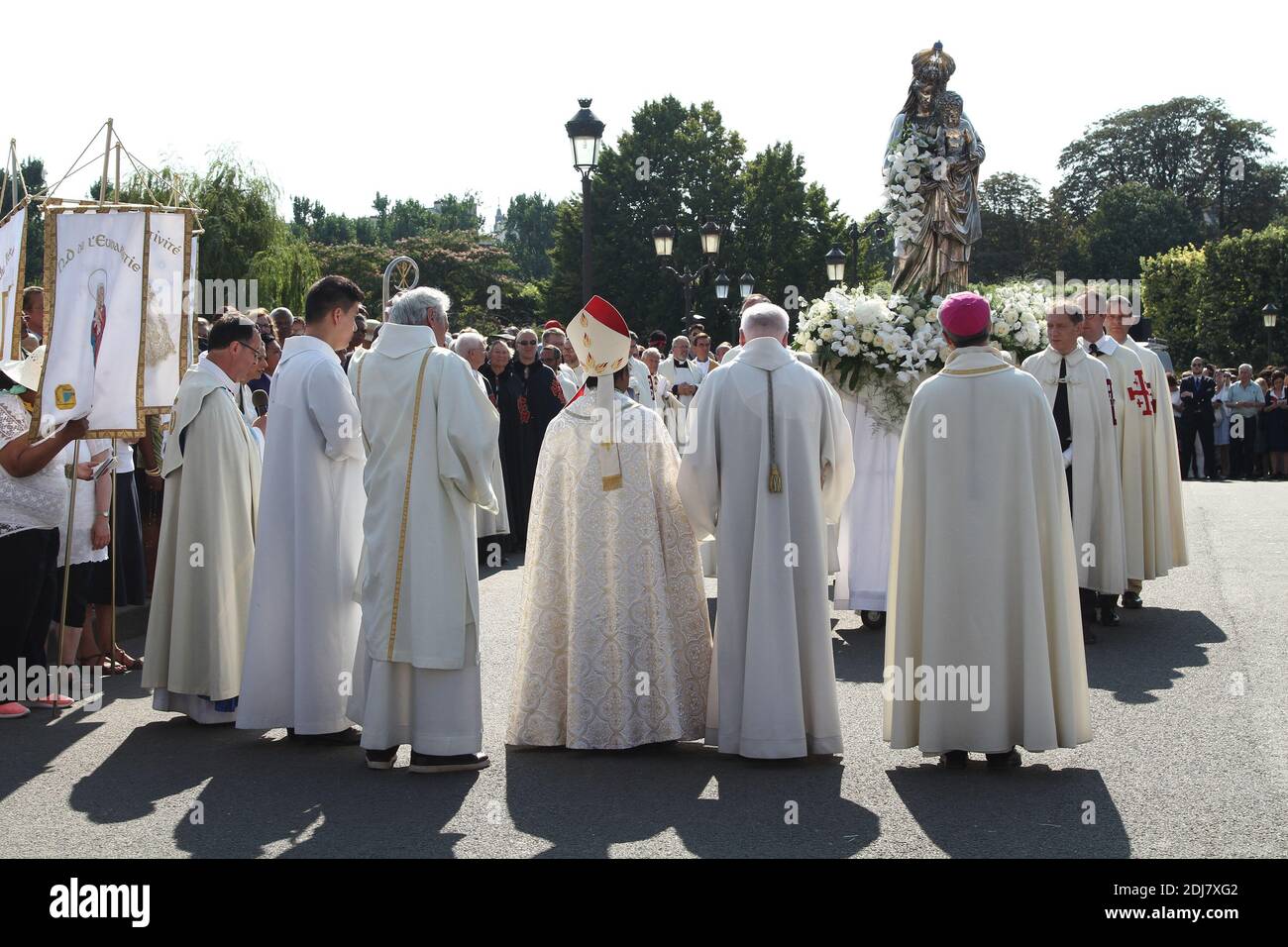 Religious people carry a statue of the Virgin Mary as they march during ...