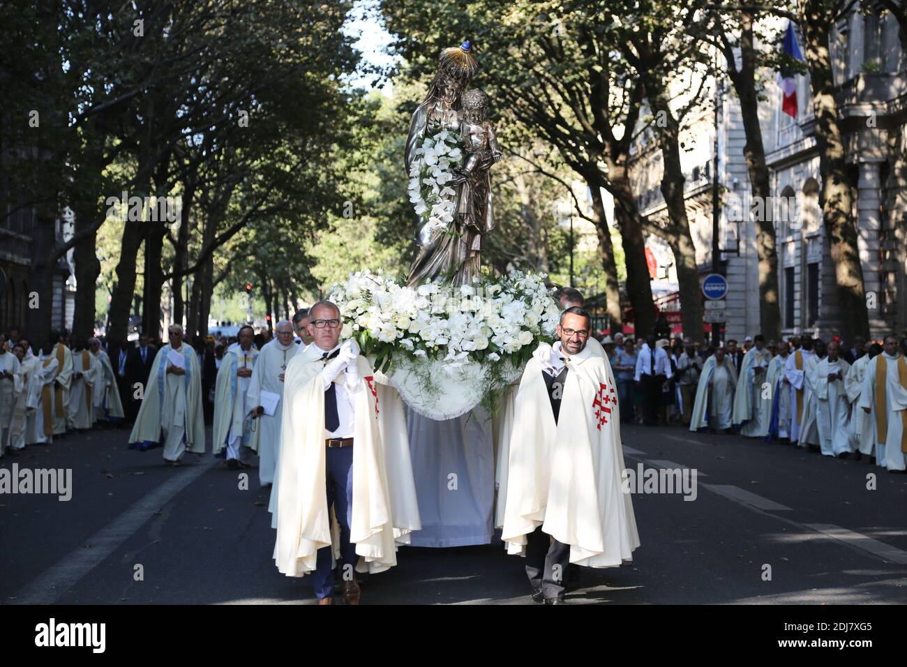 Religious people carry a statue of the Virgin Mary as they march during ...