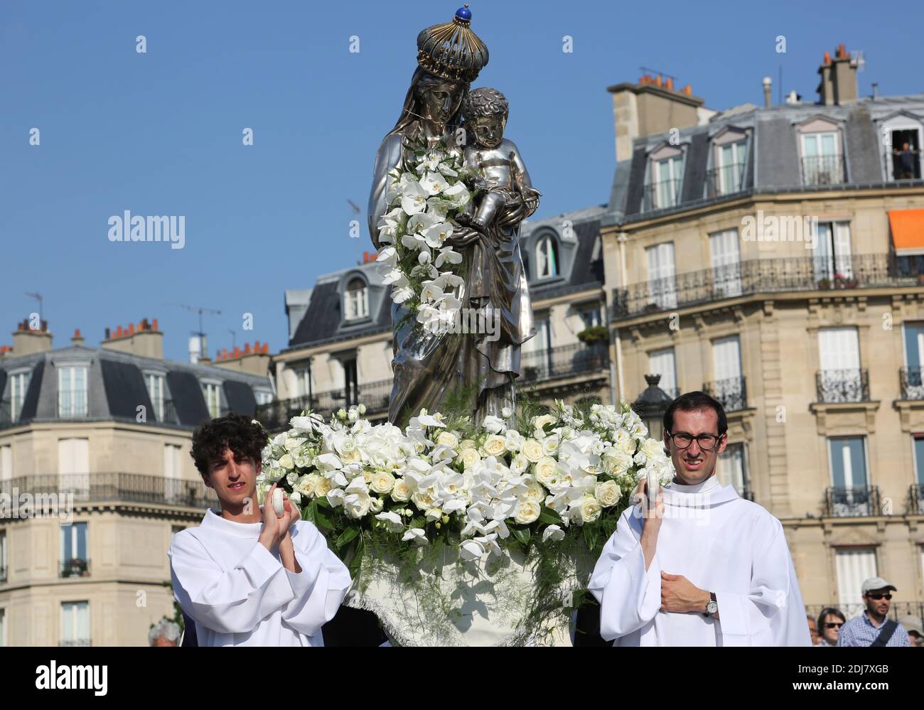 Religious people carry a statue of the Virgin Mary as they march during ...