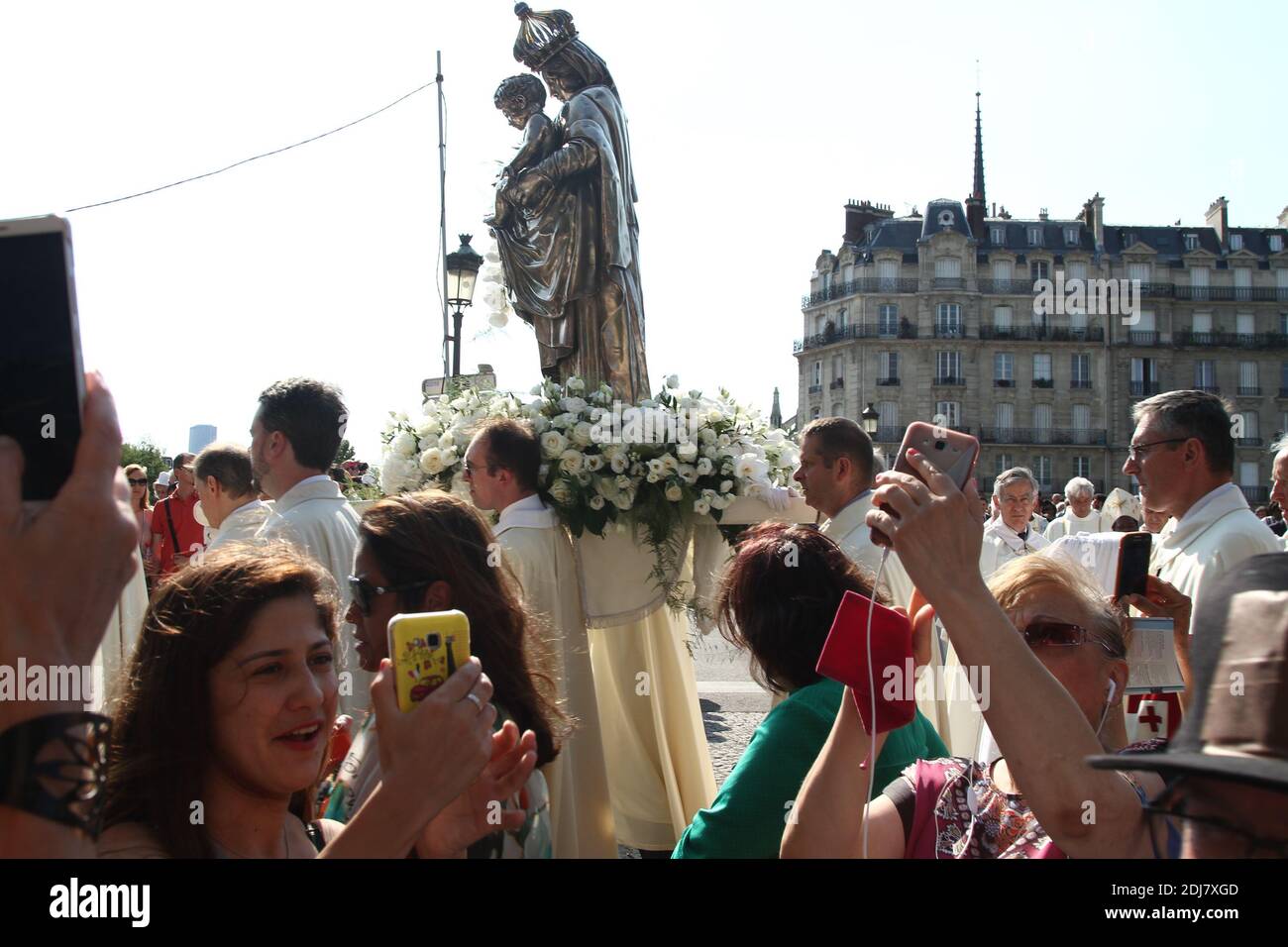 Religious people carry a statue of the Virgin Mary as they march during ...
