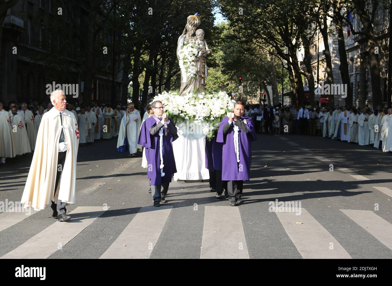Religious people carry a statue of the Virgin Mary as they march during ...