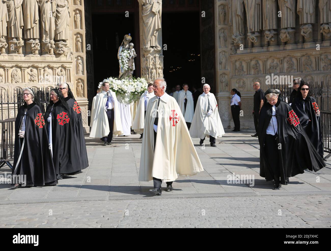 Religious people carry a statue of the Virgin Mary as they march during ...