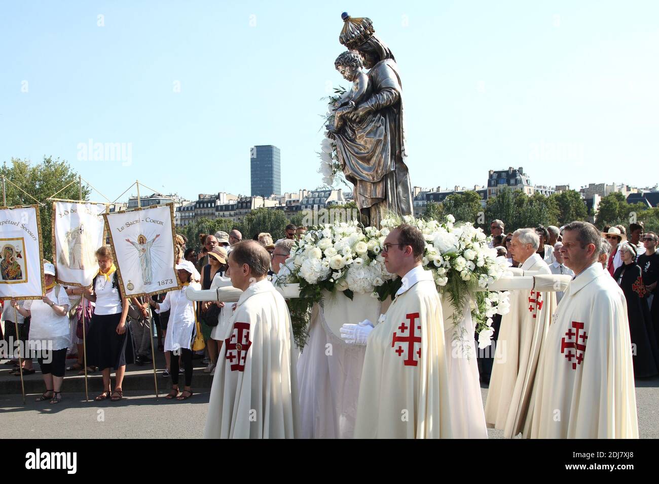Religious people carry a statue of the Virgin Mary as they march during ...