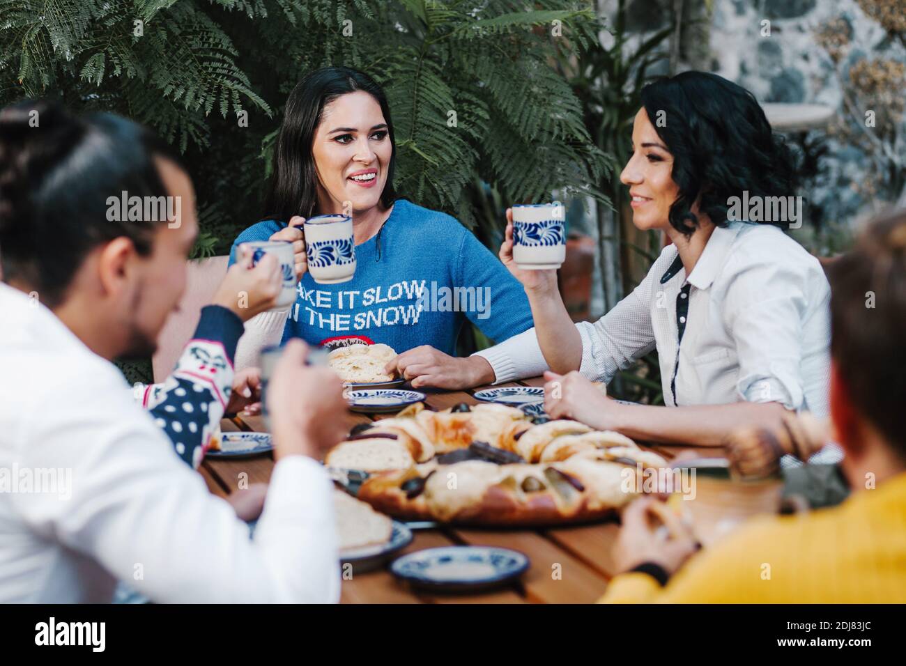mexican friends eating Rosca de reyes or Epiphany cake, Roscon de reyes ...
