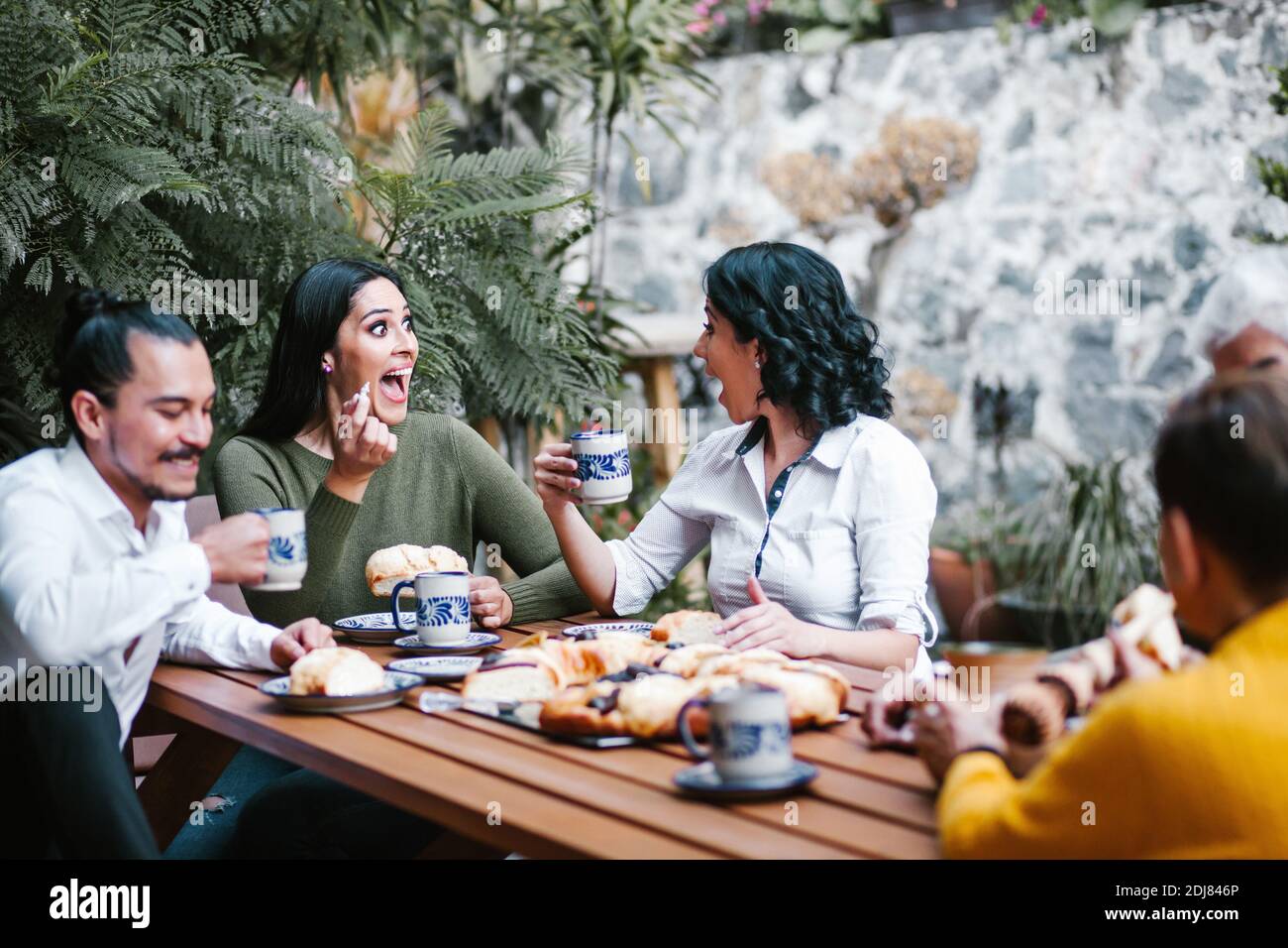 Mexican family eating Rosca de Reyes or Epiphany cake, Roscon de reyes ...