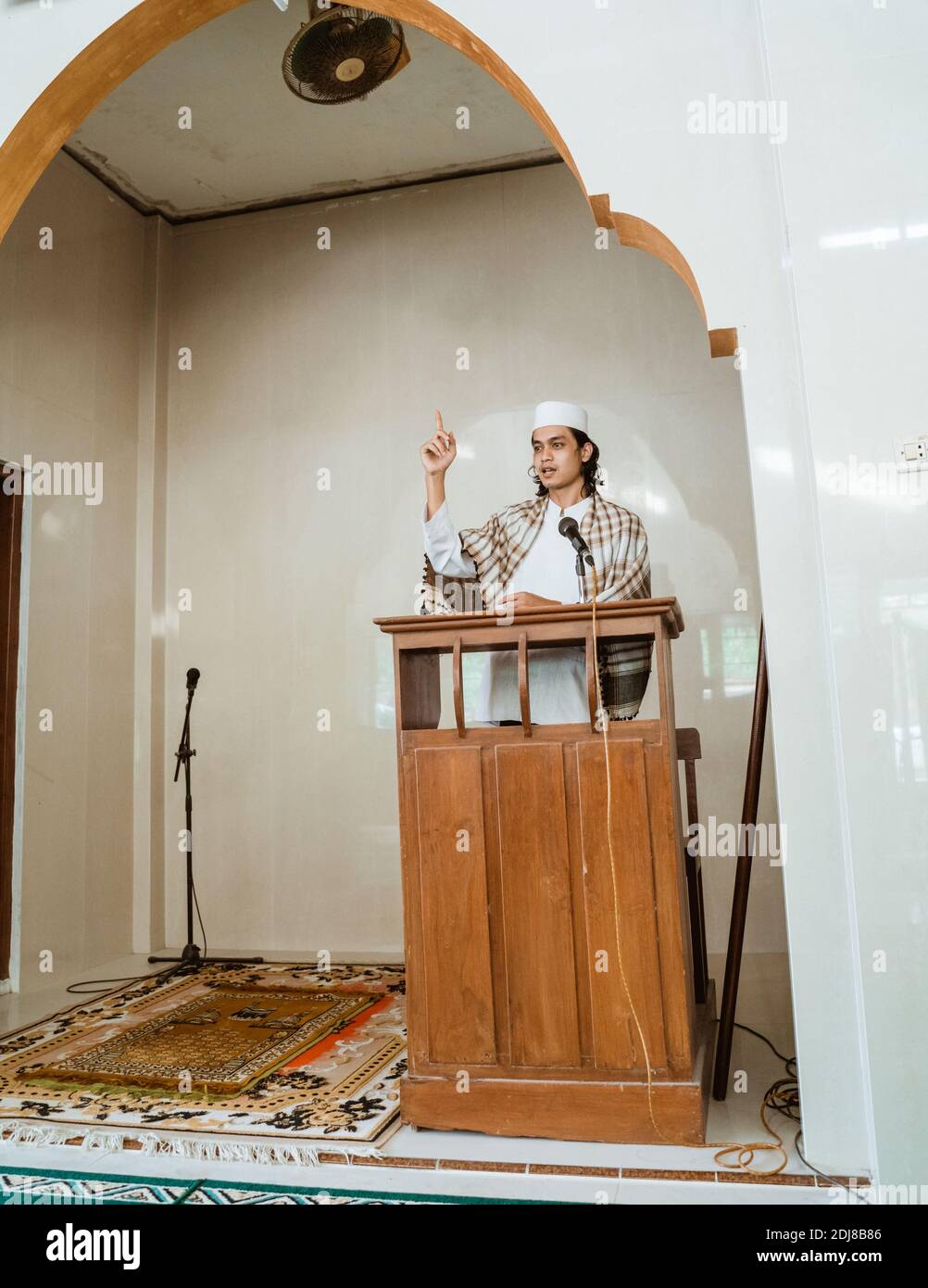 Portrait of muslim male preacher sharing about islam during prayer time ...