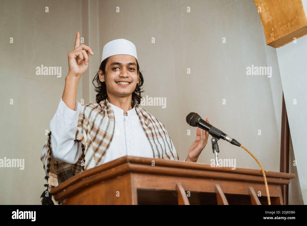 Portrait of muslim male preacher sharing about islam during prayer time ...