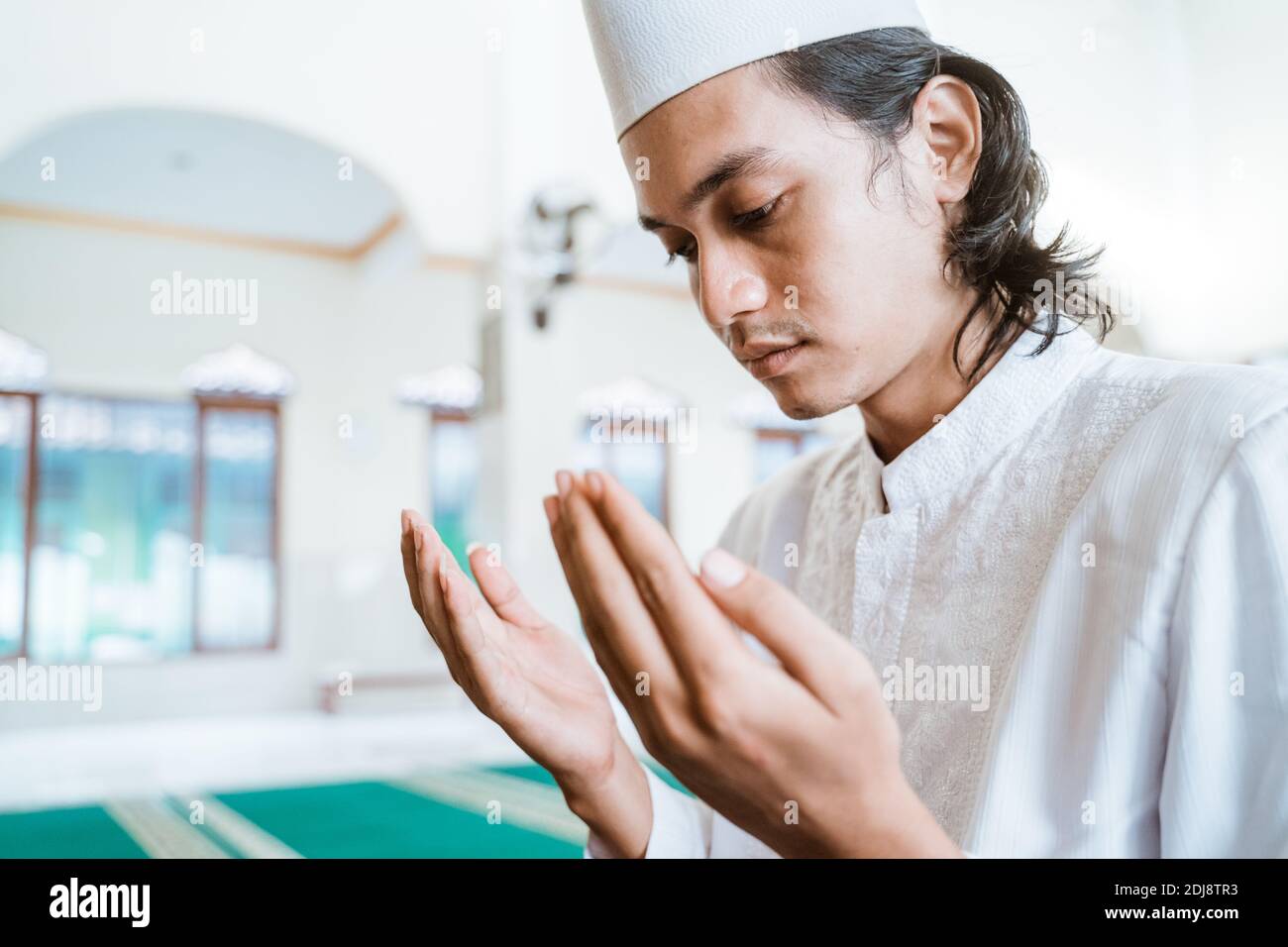 Close up man muslim doing prayer in the mosque Stock Photo - Alamy