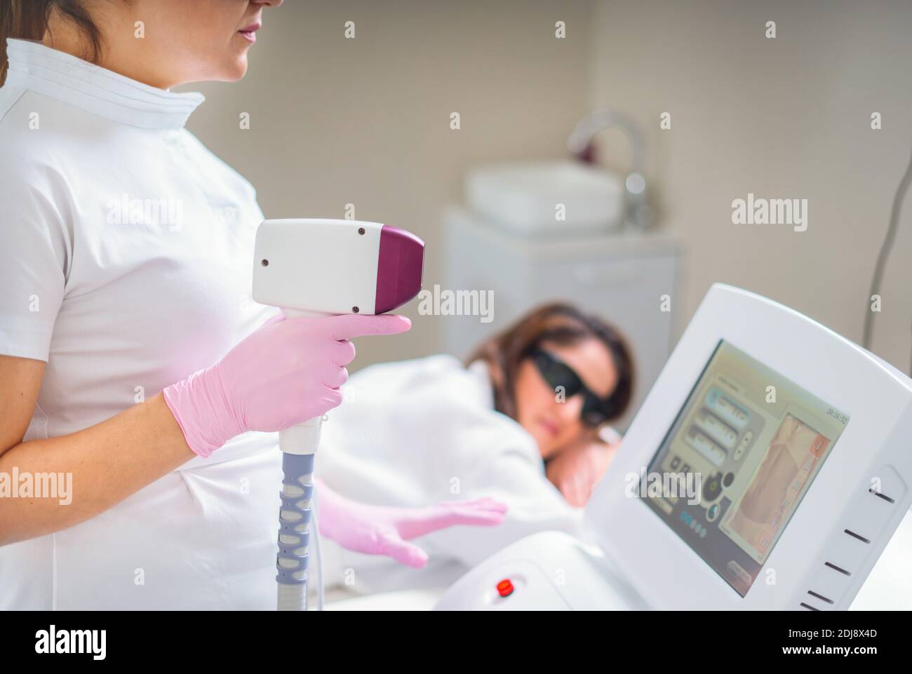 woman in professional beauty clinic during laser hair removal ...