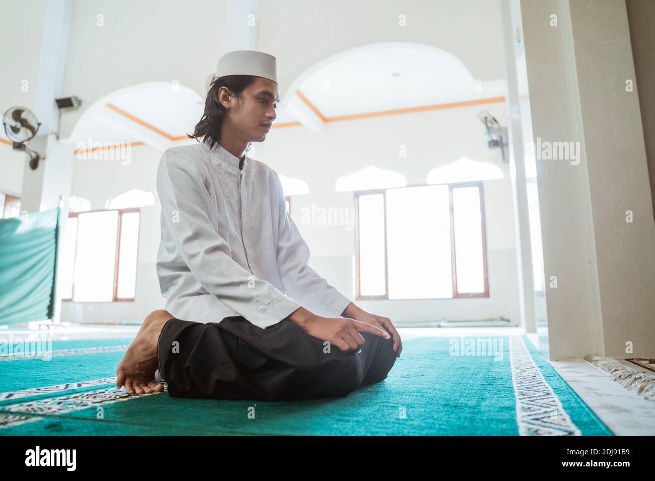Man muslim doing prayer in the mosque Stock Photo - Alamy