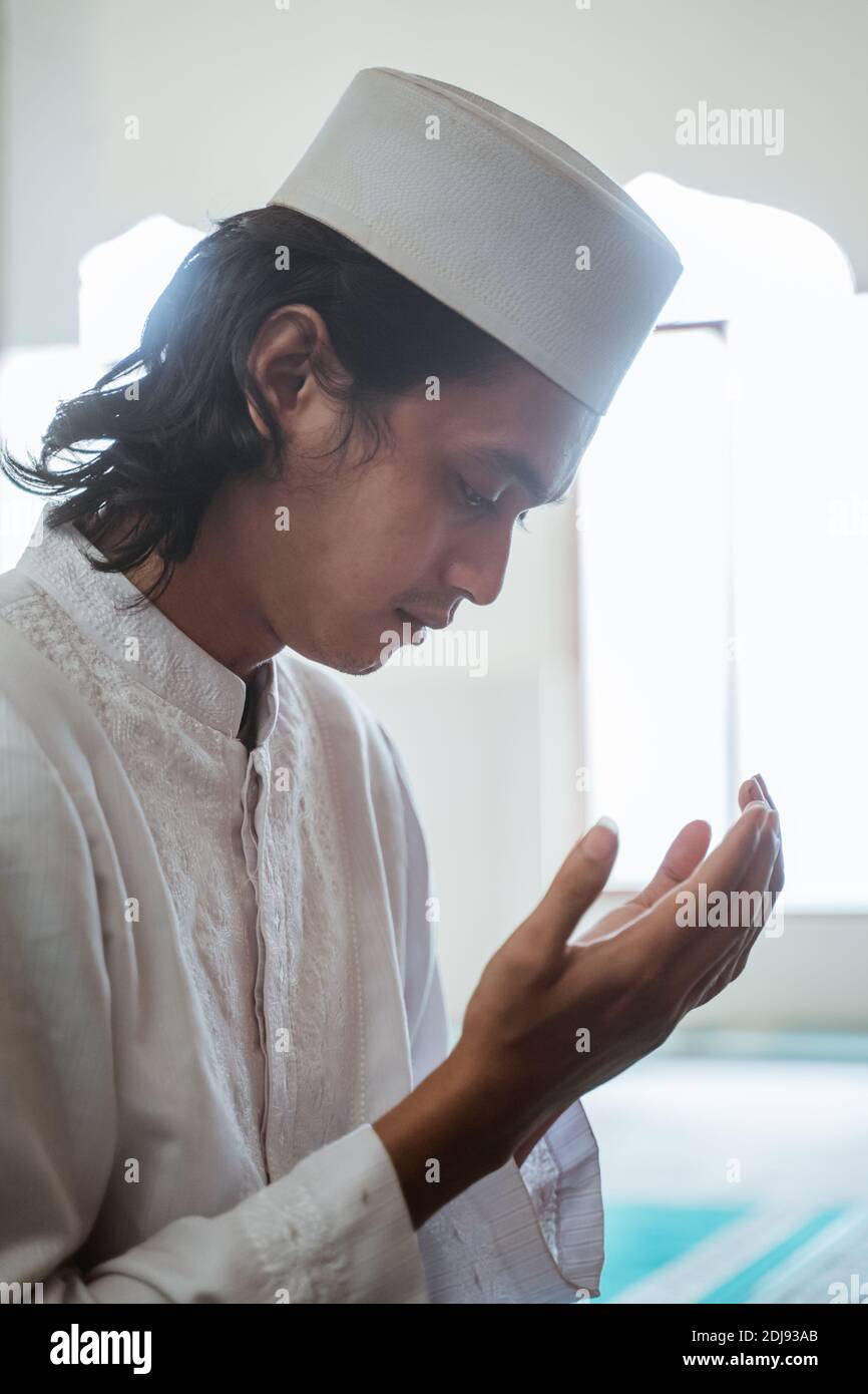 Close up man muslim doing prayer in the mosque Stock Photo - Alamy