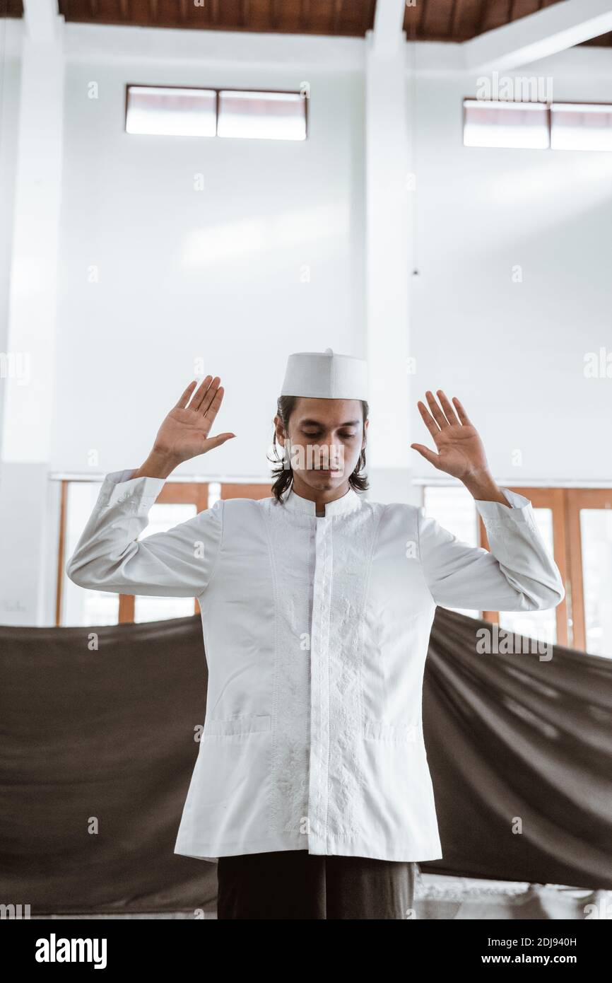 Man muslim doing prayer in the mosque Stock Photo - Alamy