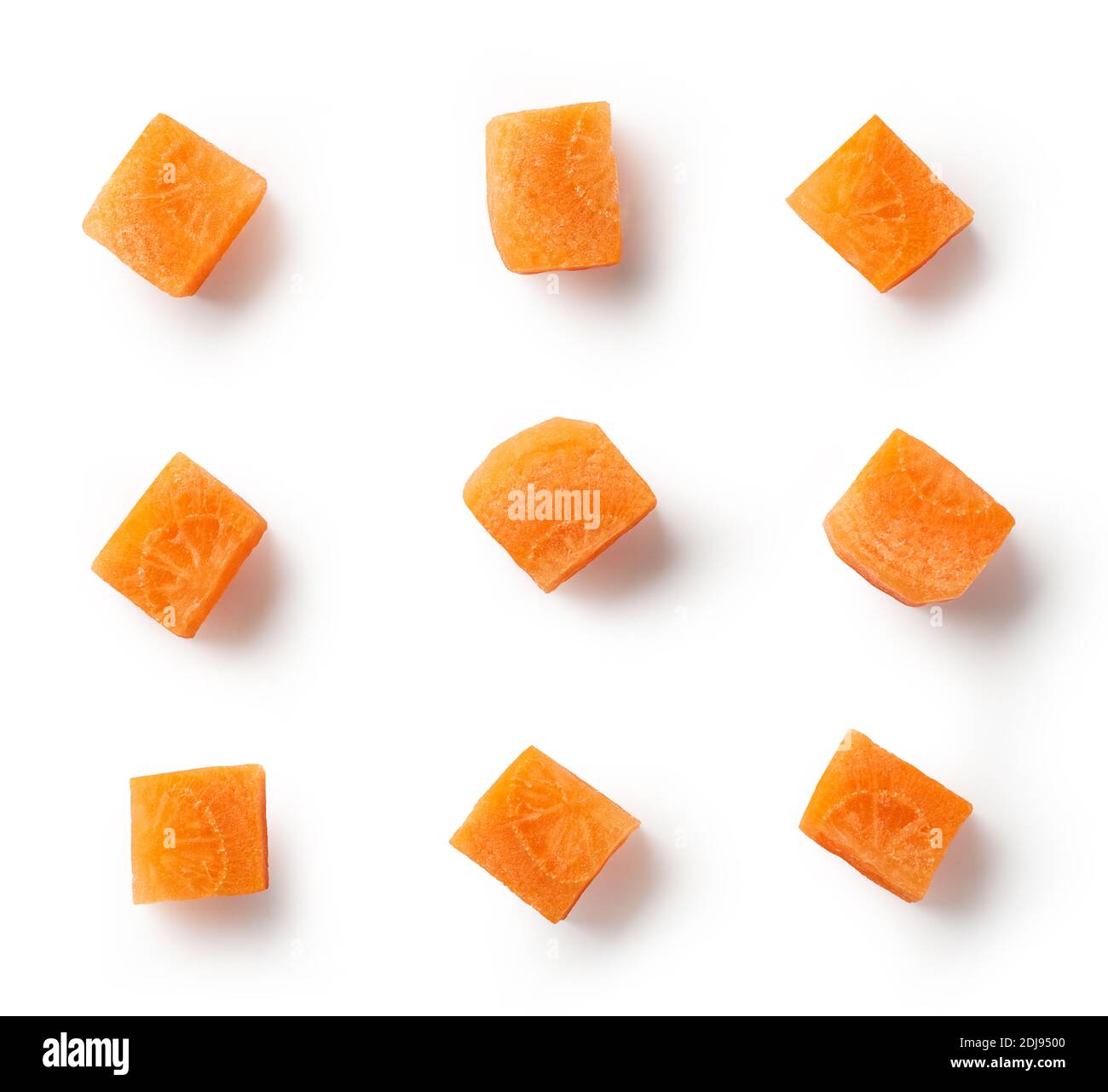 set of fresh raw carrot cubes isolated on white background, top view ...