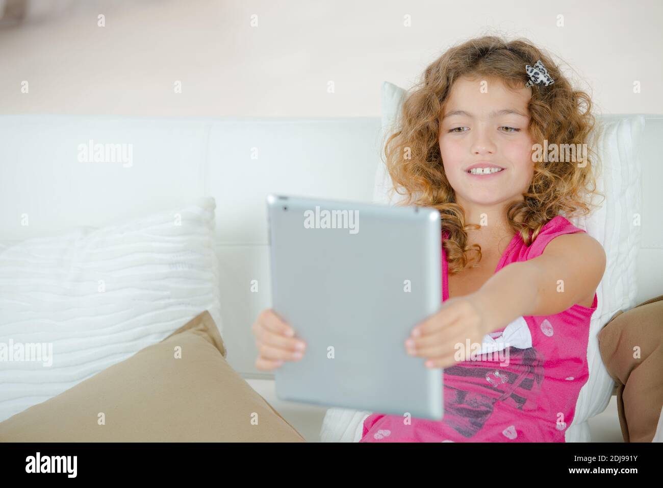 a little girl on tablet Stock Photo - Alamy