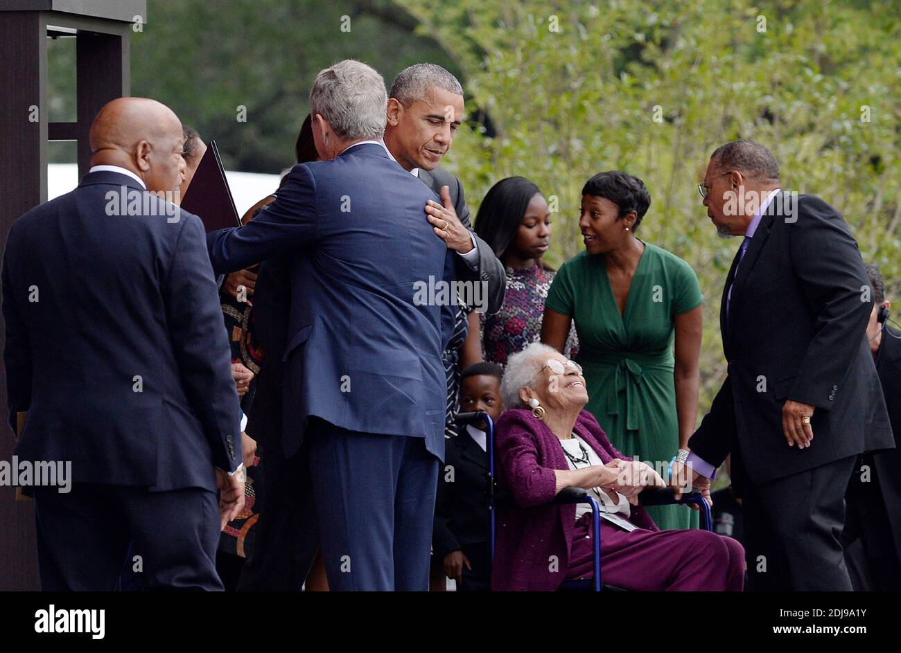 U.S President Barack Obama hugs former President George W. Bush as Rep ...