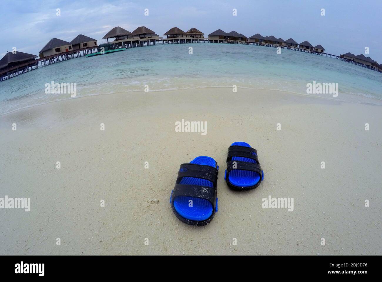 Blue sandals on a beautiful white beach and resorts of Maldives Stock ...