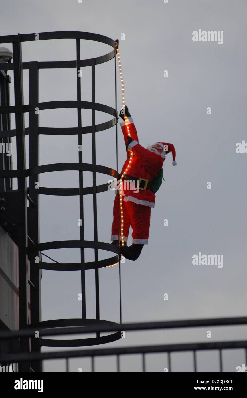 Santa climbing ladder hi-res stock photography and images - Alamy