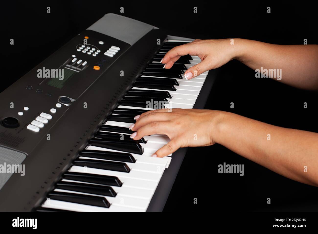 Piano isolated piano keys female hand hi-res stock photography and ...