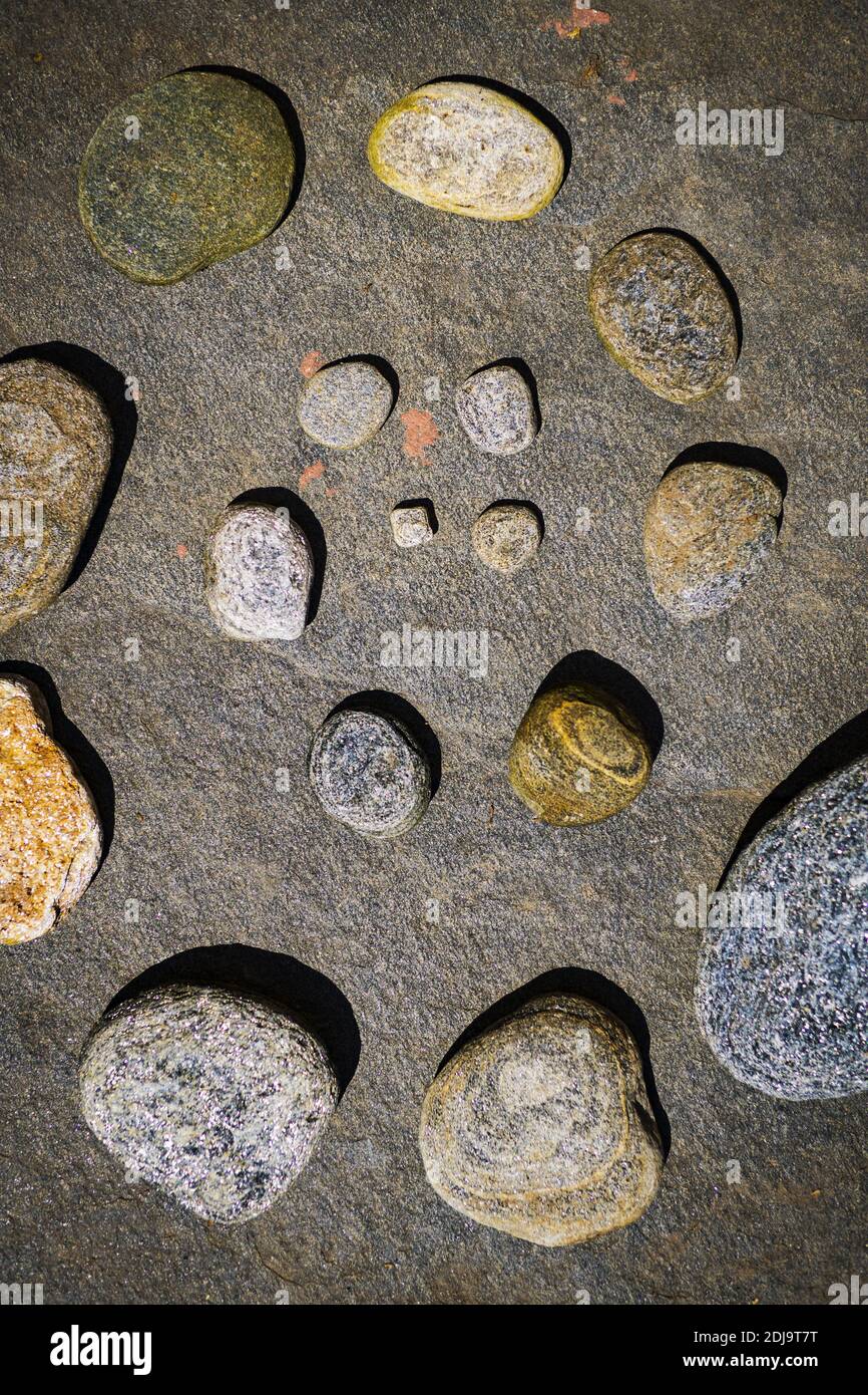A vertical shot of various stones put in a spiral Stock Photo - Alamy