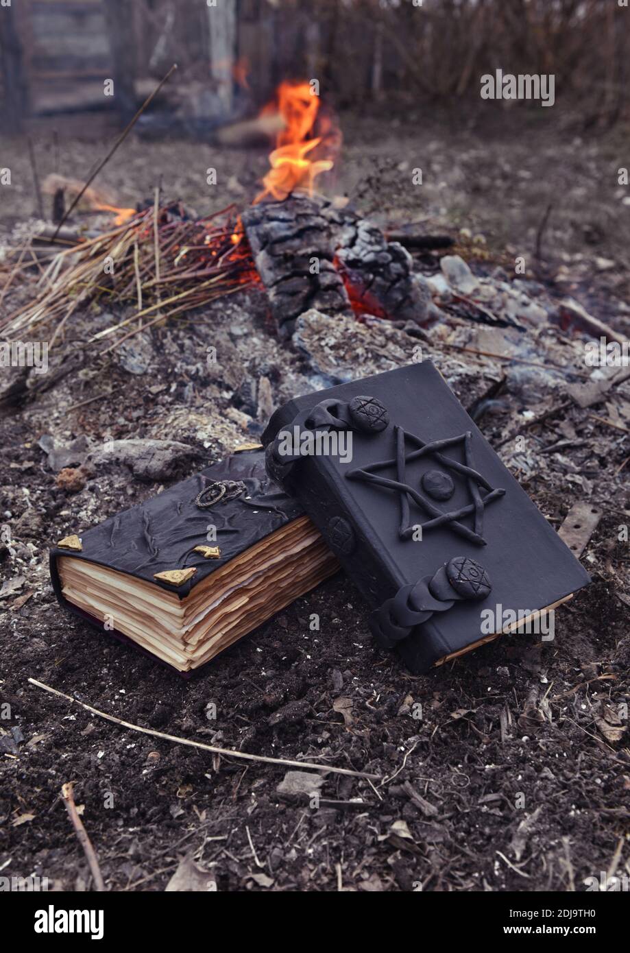 Mystical concept with voodoo objects, book and straw doll, esoteric ...