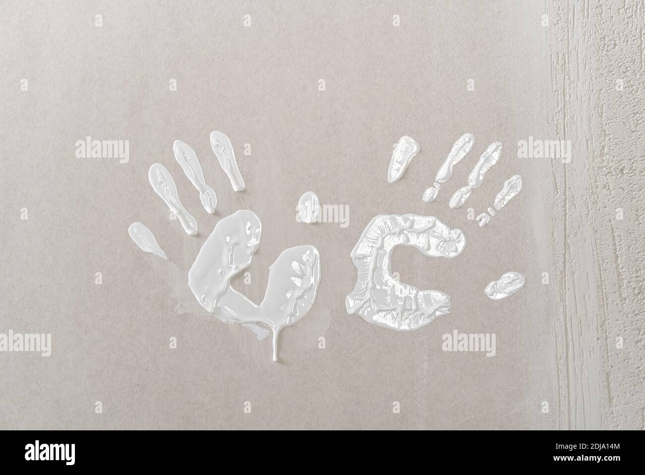 Hand print made with white paint on drywall. painter have fun Stock ...