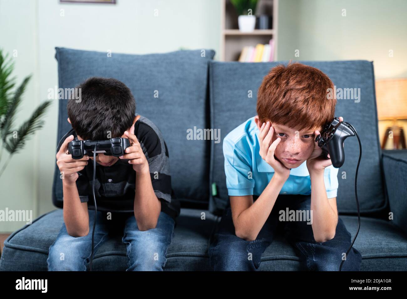 Asian friends playing console hi-res stock photography and images - Alamy