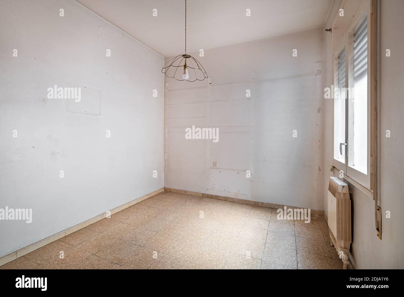 Empty, old and dirty room with white walls and traces of shelves Stock ...