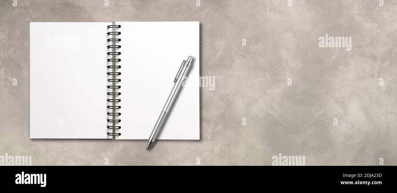 Blank open spiral notebook mockup and pen isolated on concrete banner ...
