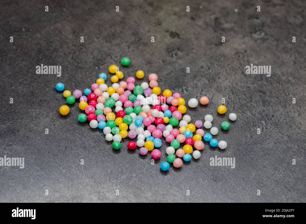 Round, multi-colored candies. Candy closeup on a white background Stock ...