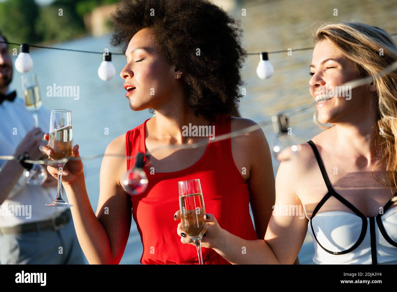 Group of friends having fun and celebrating group gathering outdoor ...