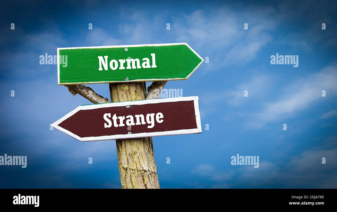 Street Sign the Direction Way to Normal versus Strange Stock Photo - Alamy