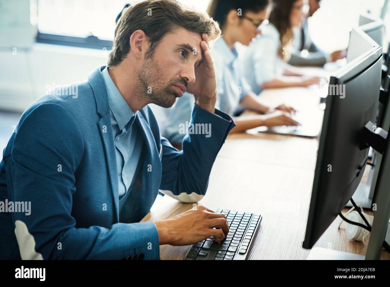 Programmer working in a software developing company Stock Photo - Alamy