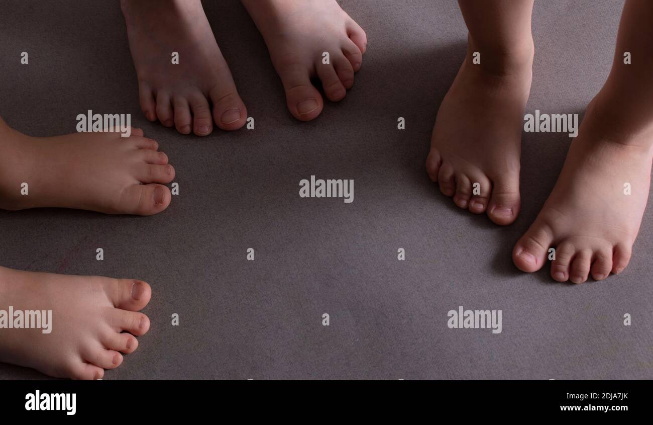 three legs of children together, top view Stock Photo - Alamy