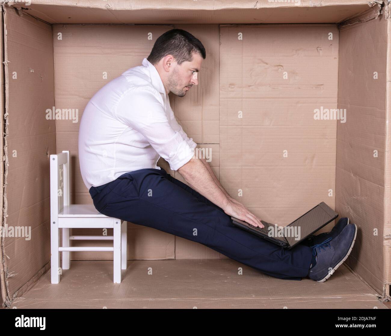 broken businessman in a cardboard office, stress and depression from ...